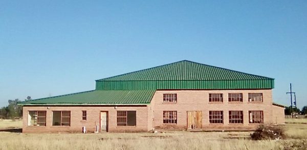 Bad roads and no tap water but there's a multi-million community hall