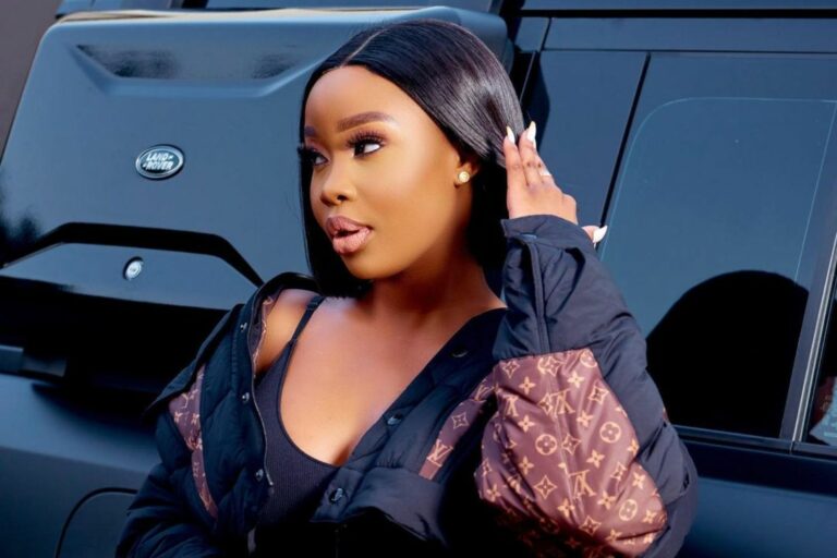 Sithelo Shozi turns heads in R180k outfit next to R1.3m car