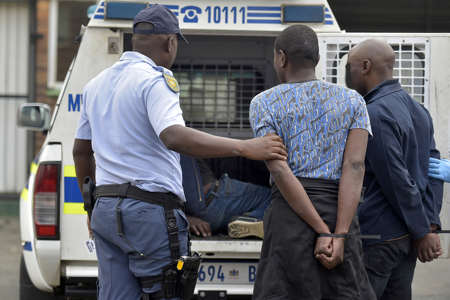 Alleged business robbers shot, arrested by police