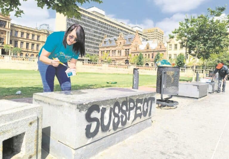 Volunteers scrape off graffiti, clean up iconic Church Square | The Citizen