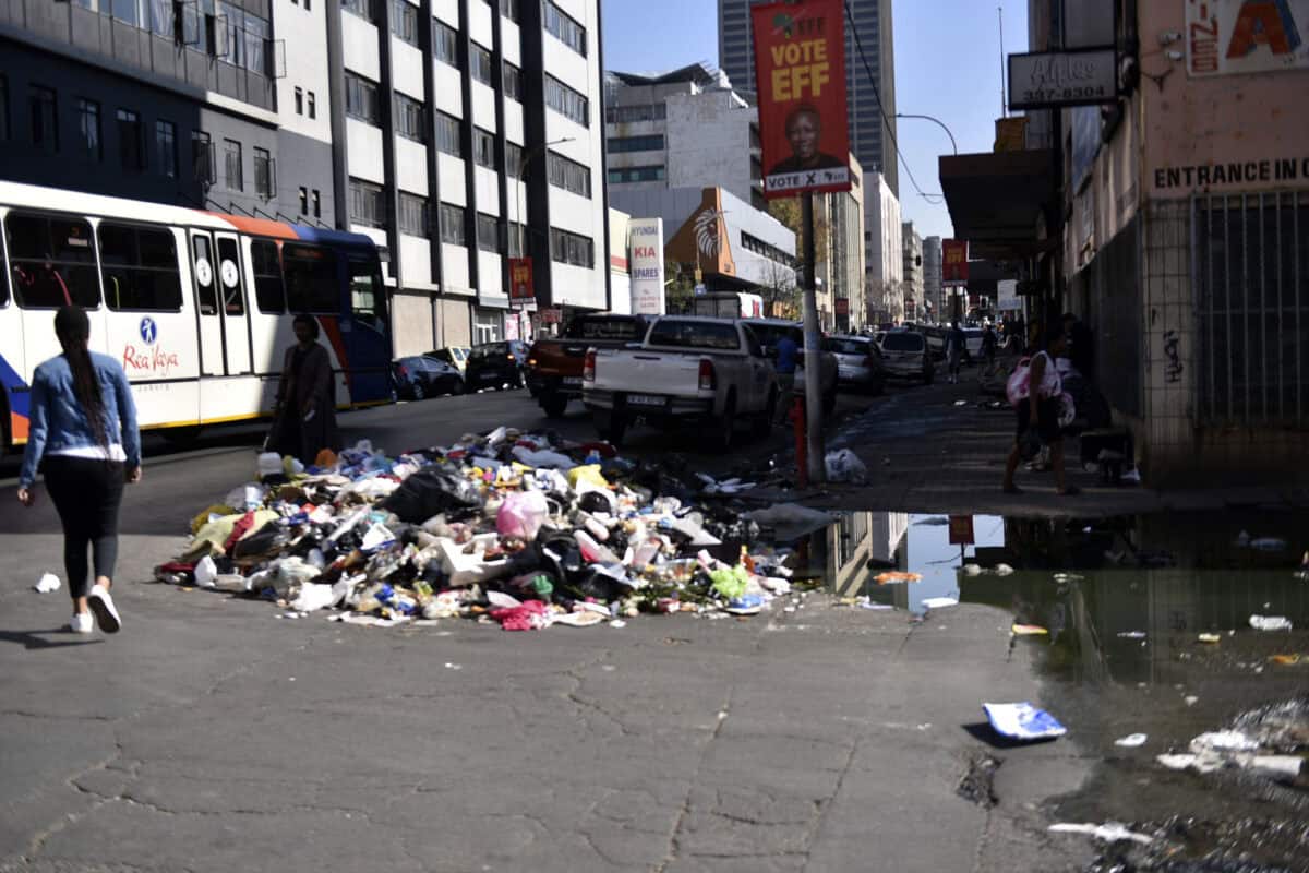 Watch: Pikitup workers collect rubbish under guard as 'some arrests ...