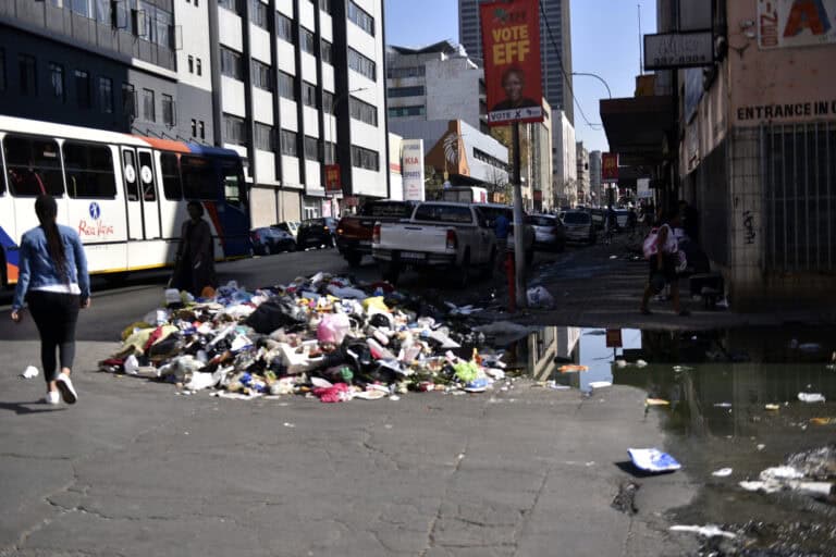 Watch: Pikitup workers collect rubbish under guard as 'some arrests ...