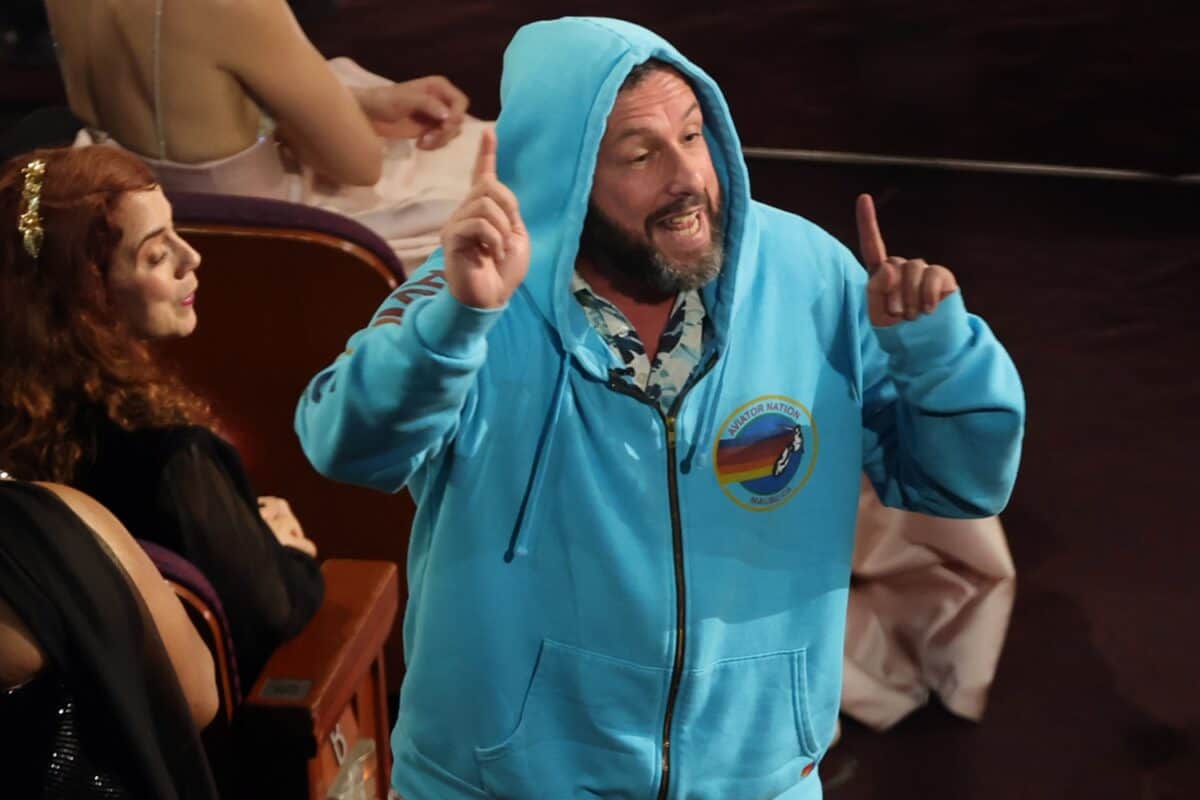 Adam Sandler walks out at the Oscars – basketball shorts and all